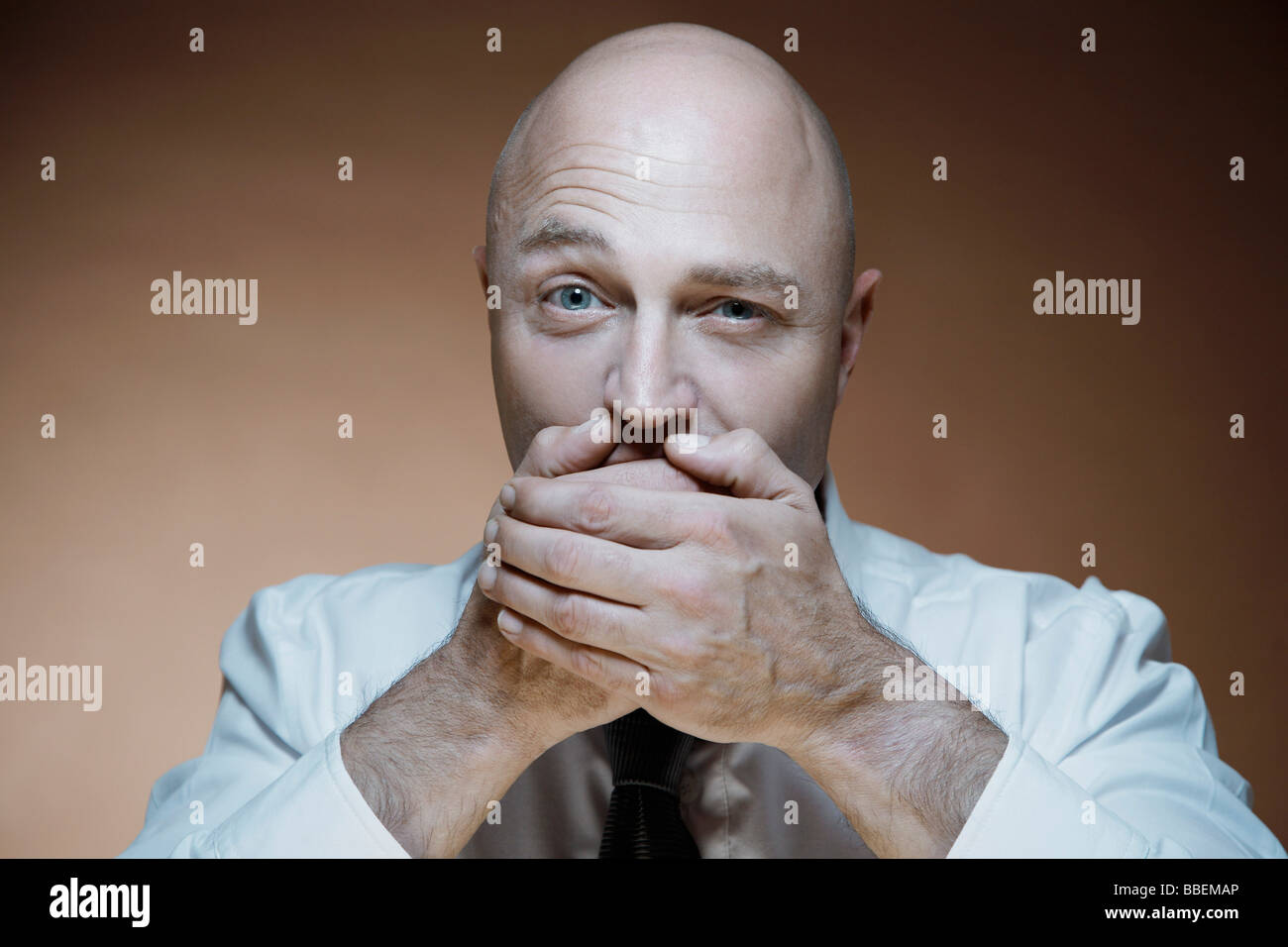 Man With Hand Over Mouth High Resolution Stock Photography and Images ...