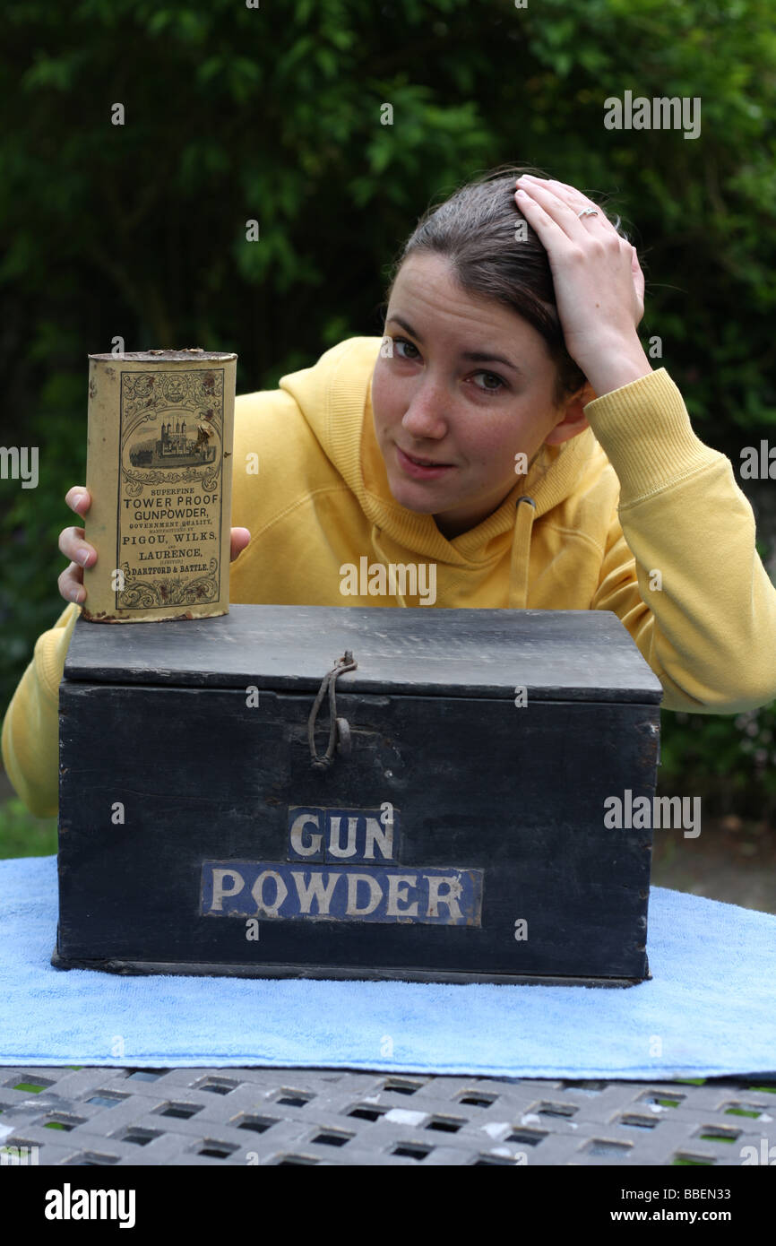Young woman with gunpowder box and tin (both empty Stock Photo - Alamy