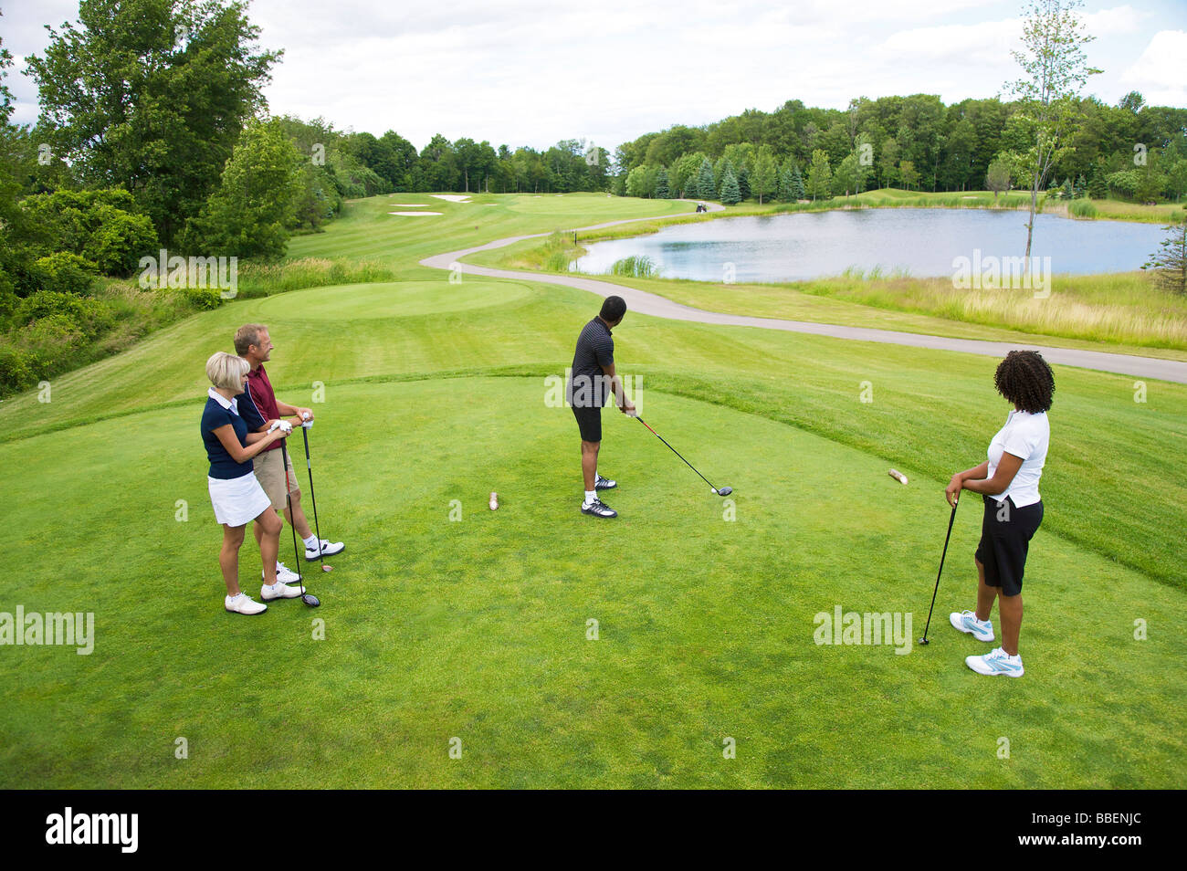 Group of People Golfing Stock Photo - Alamy