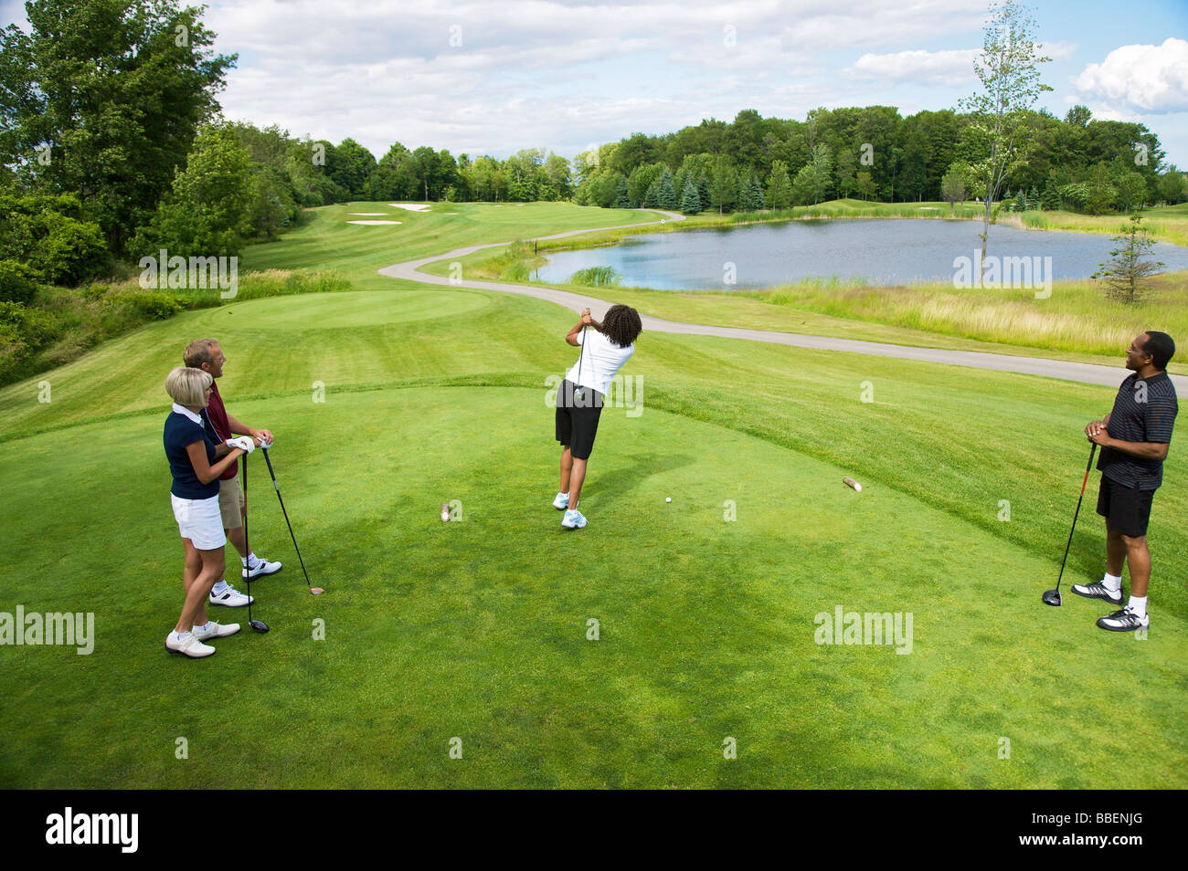 Group of People Golfing Stock Photo - Alamy