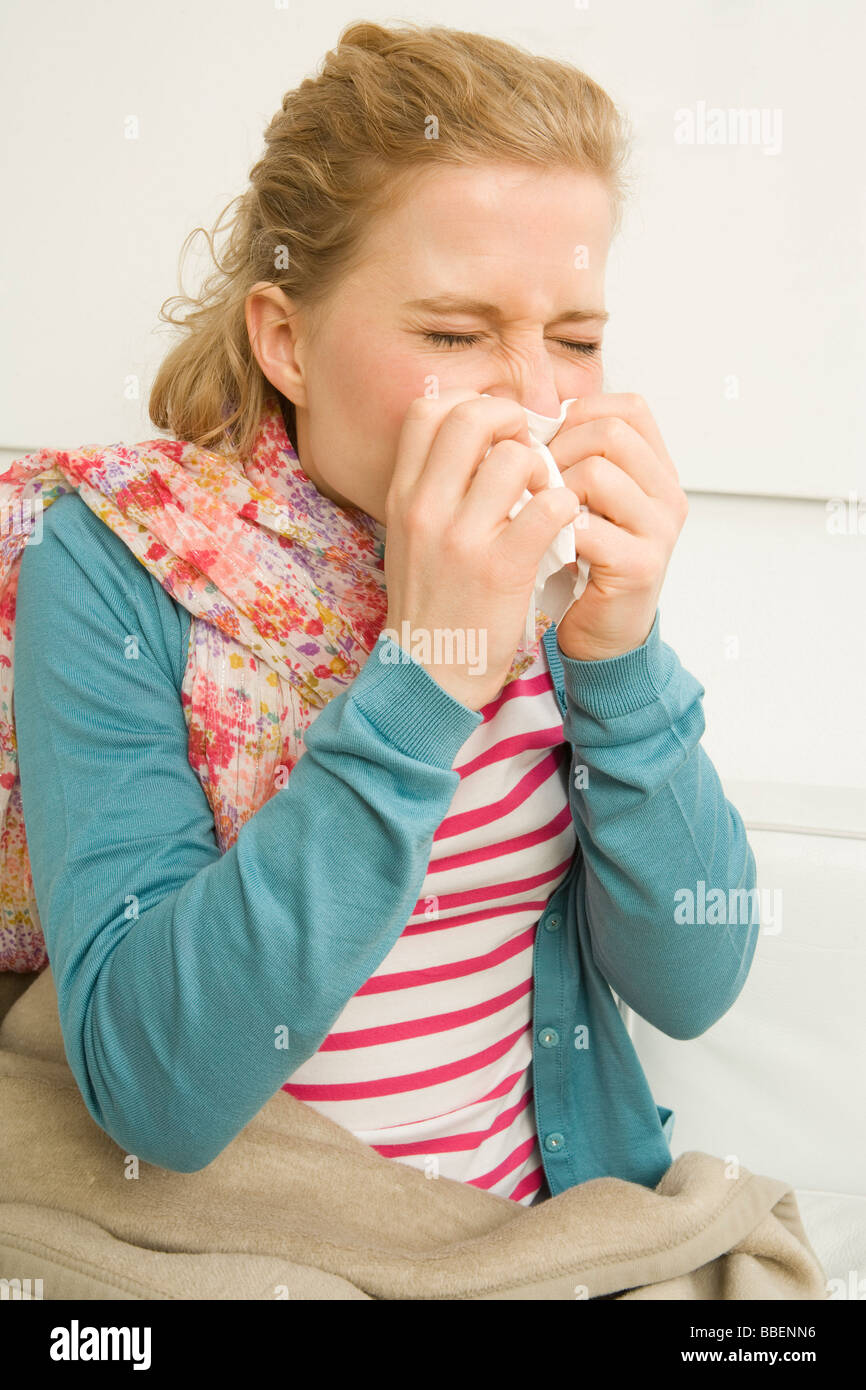 Woman Blowing Nose Stock Photo - Alamy