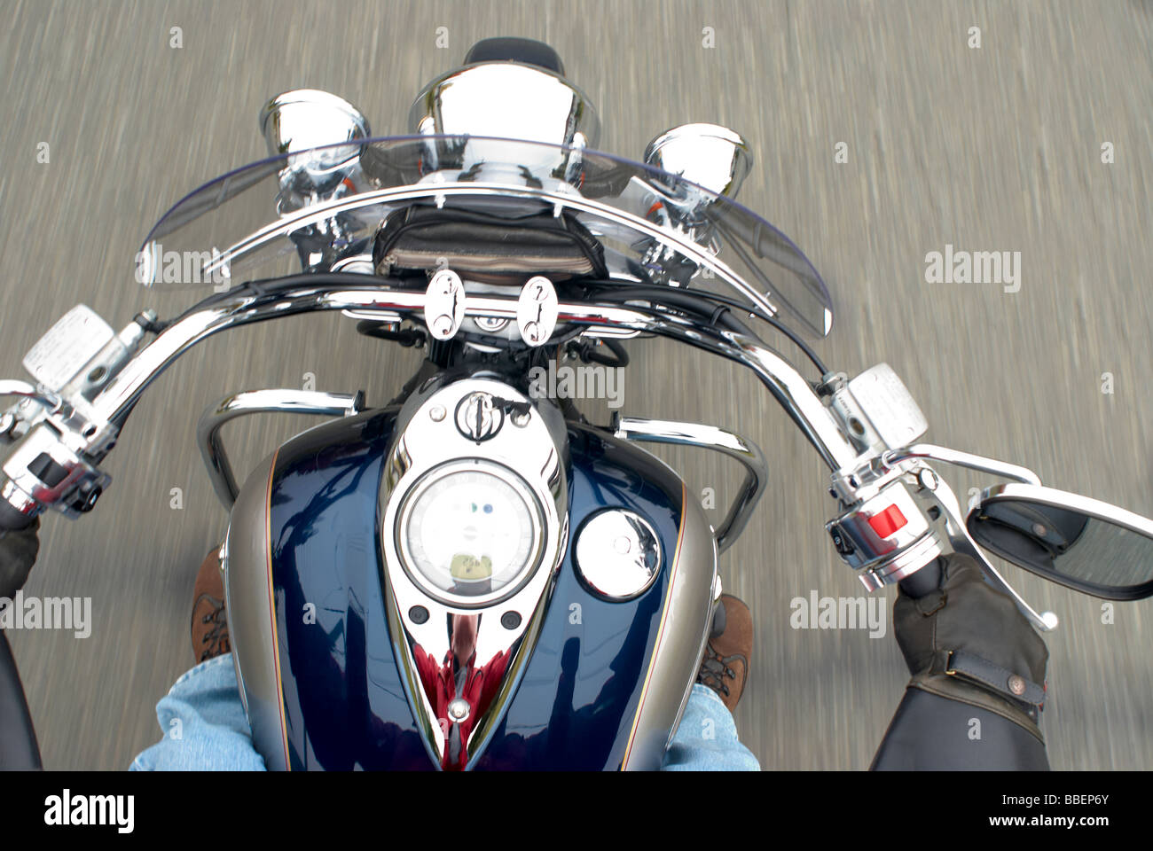 Looking down on the handlebars of a Vulcan Motorcycle as it is driving ...