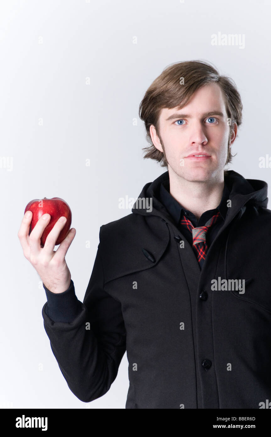 Ethnic male holding an apple hi-res stock photography and images - Alamy