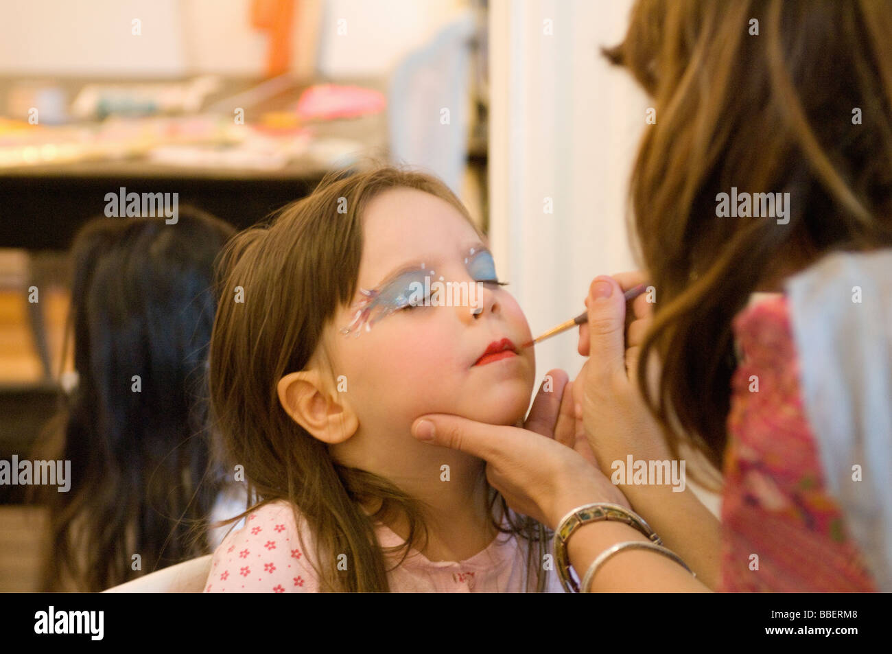 A Little Girl Getting Make-Up Applied Stock Photo - Alamy