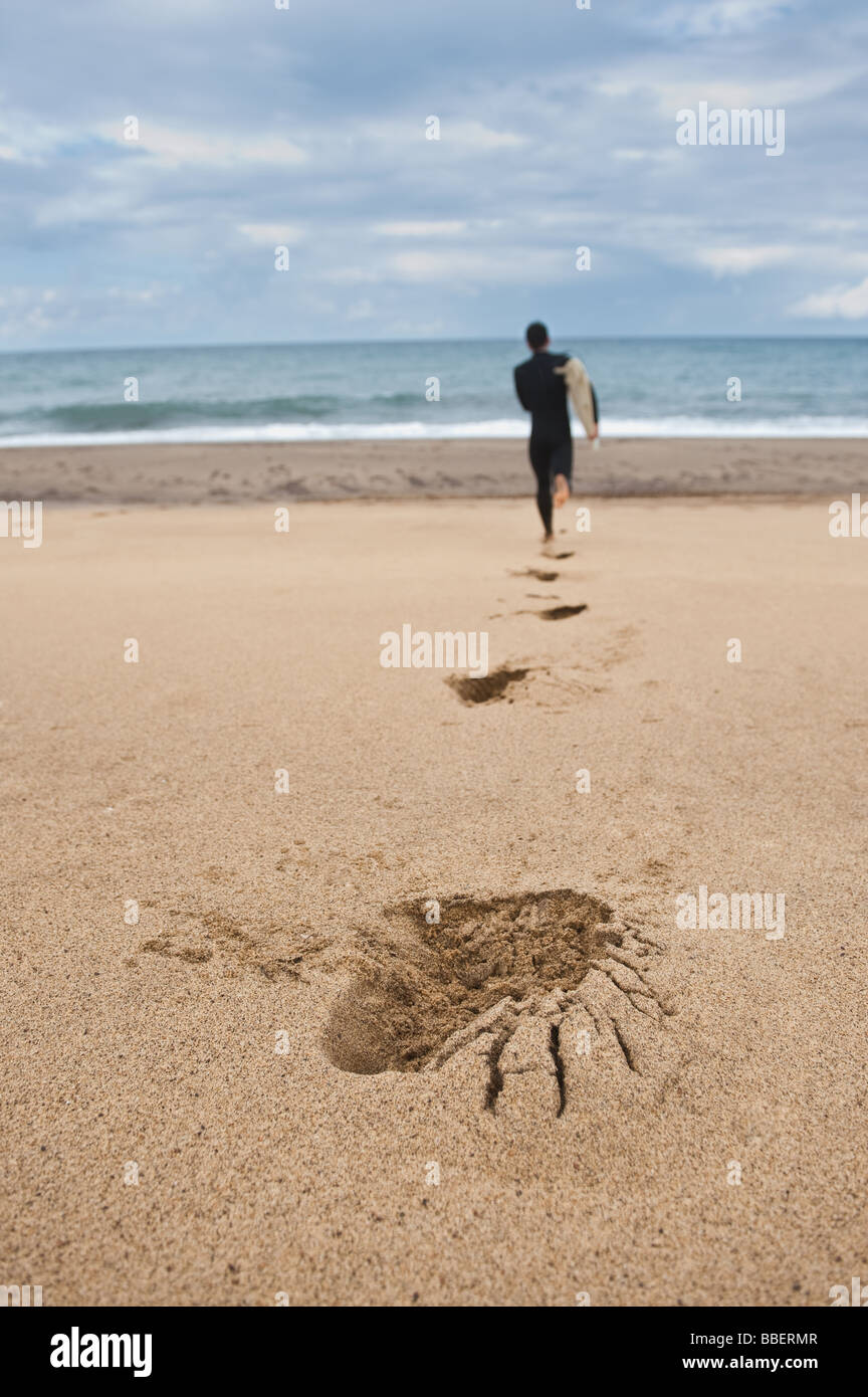 Surfer with surfboard Stock Photo - Alamy