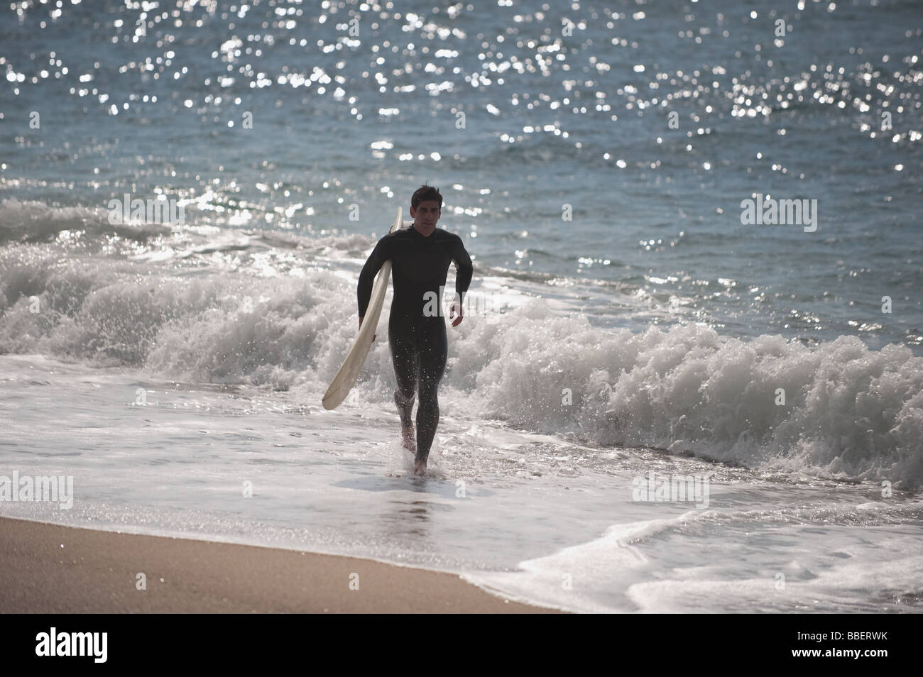 Surfer with surfboard Stock Photo - Alamy