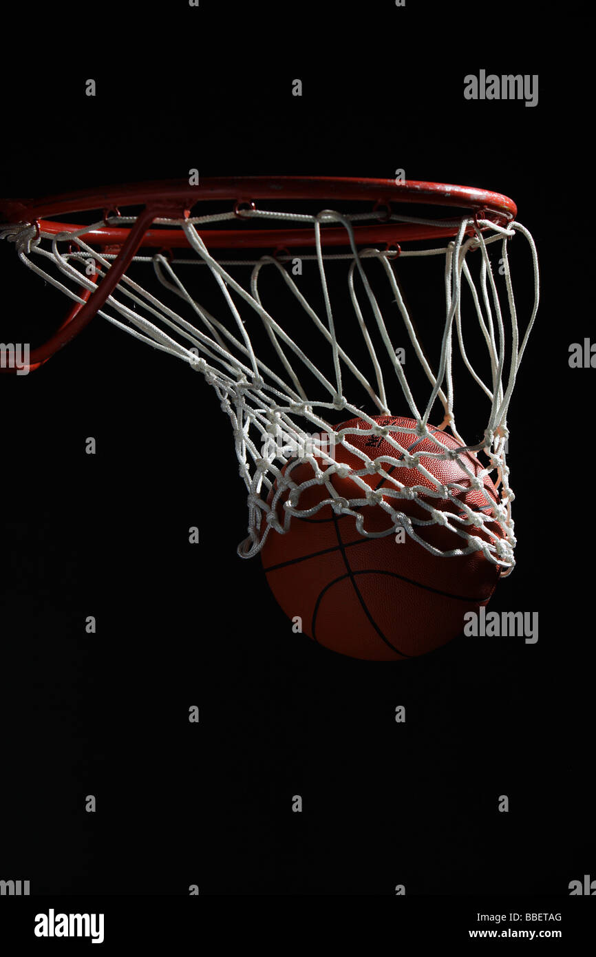 Basketball going through net hi-res stock photography and images - Alamy