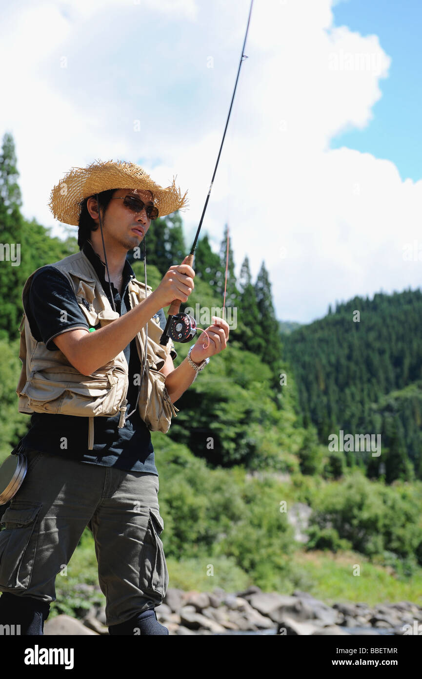 Young japanese man fishing hi-res stock photography and images - Alamy
