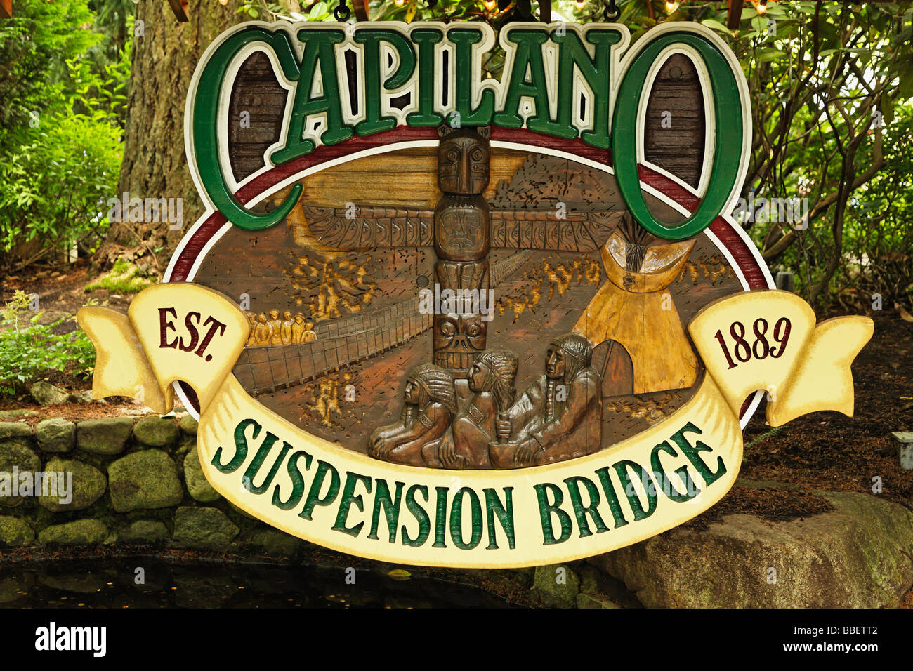 Wood carved sign at the entry of Capilano Suspension Bridge Vancouver ...
