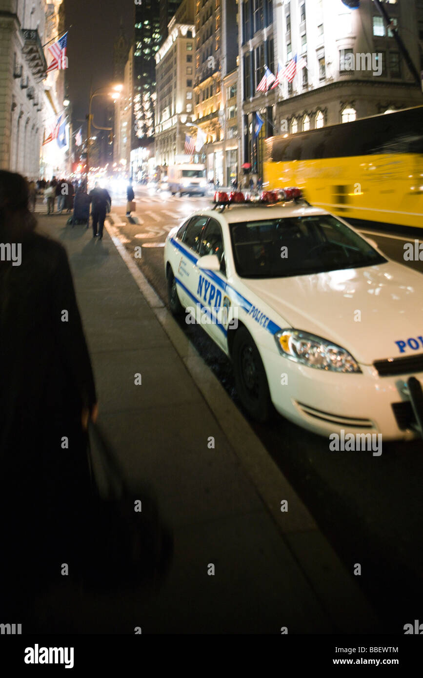 Police car parked on busy street Stock Photo - Alamy