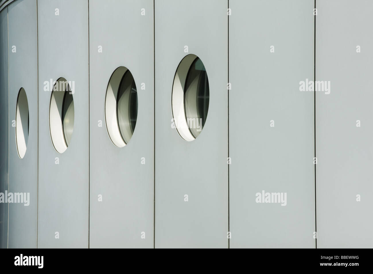 Circular windows on building facade Stock Photo - Alamy
