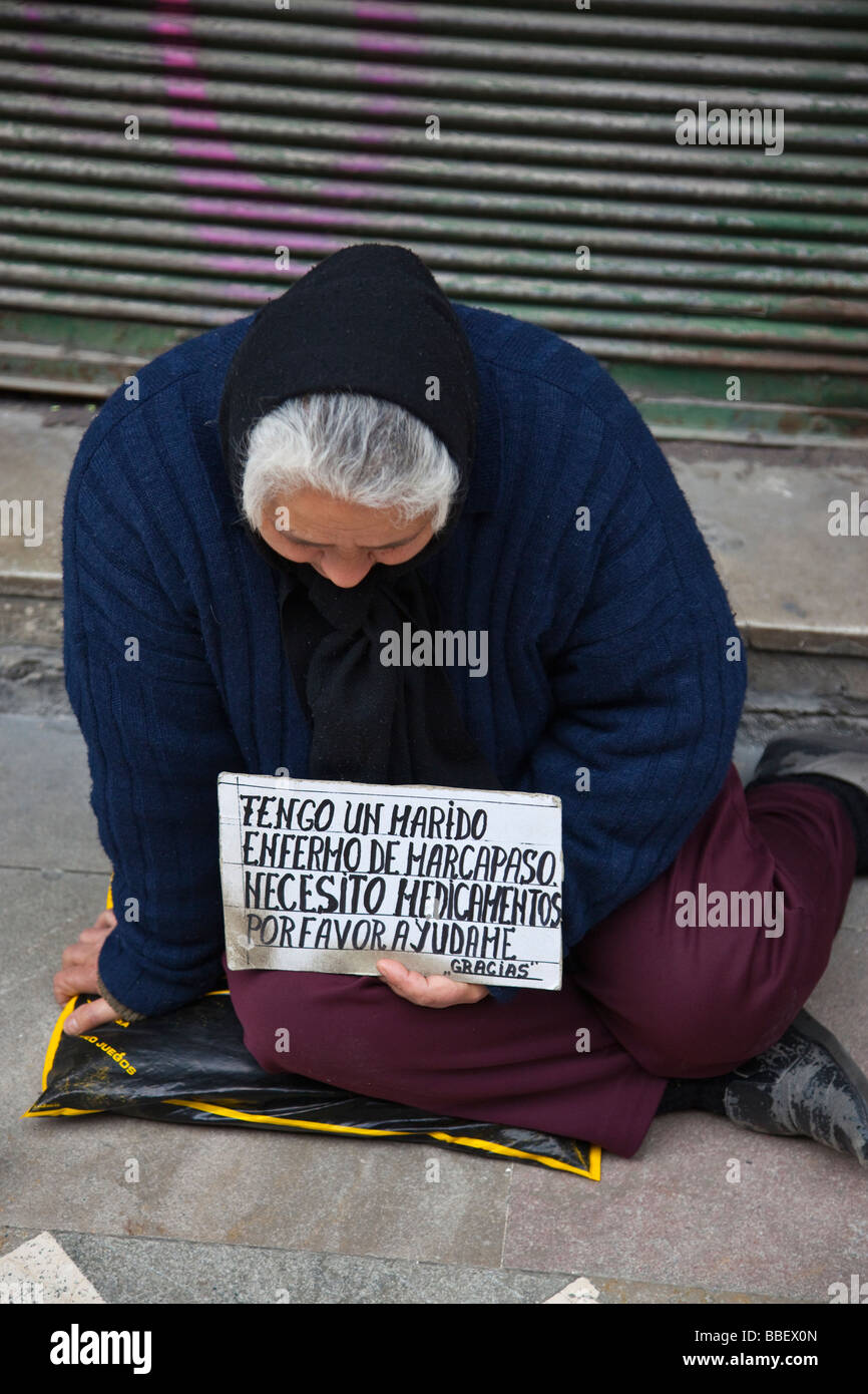Poor woman begging hi-res stock photography and images - Alamy