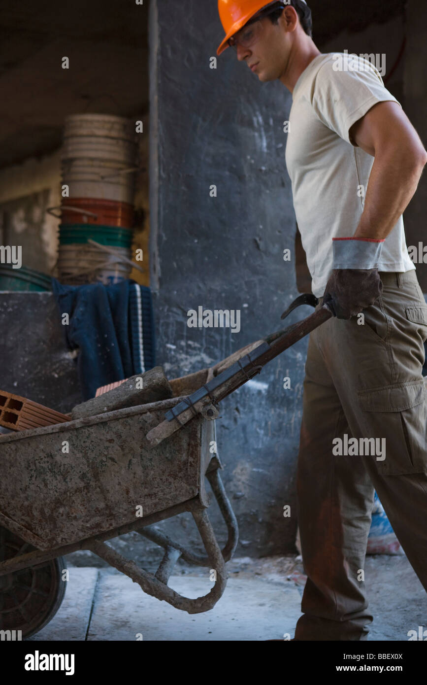 Construction Worker Pushing Wheelbarrow High Resolution Stock ...