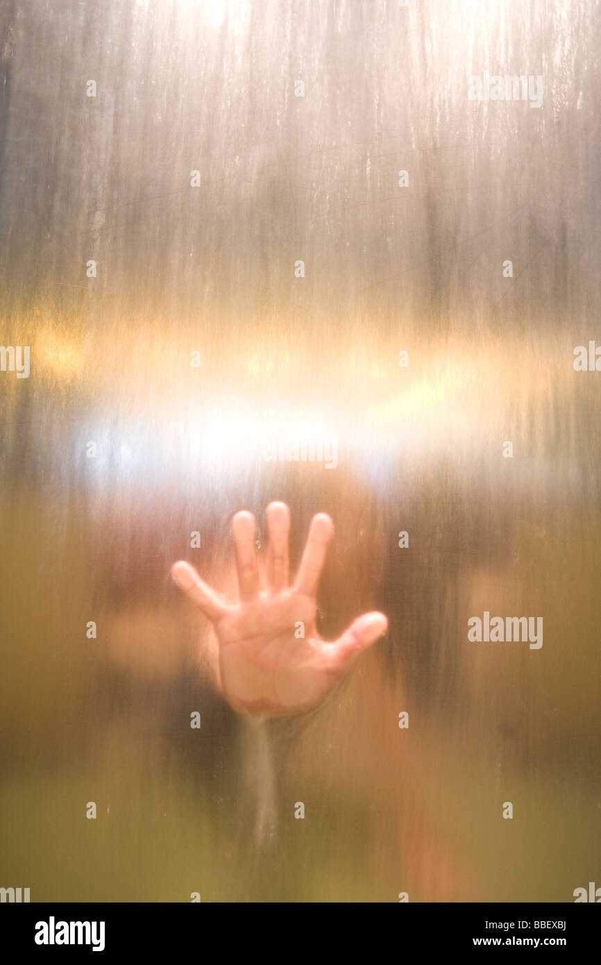Hand seen through glass and running water Stock Photo - Alamy