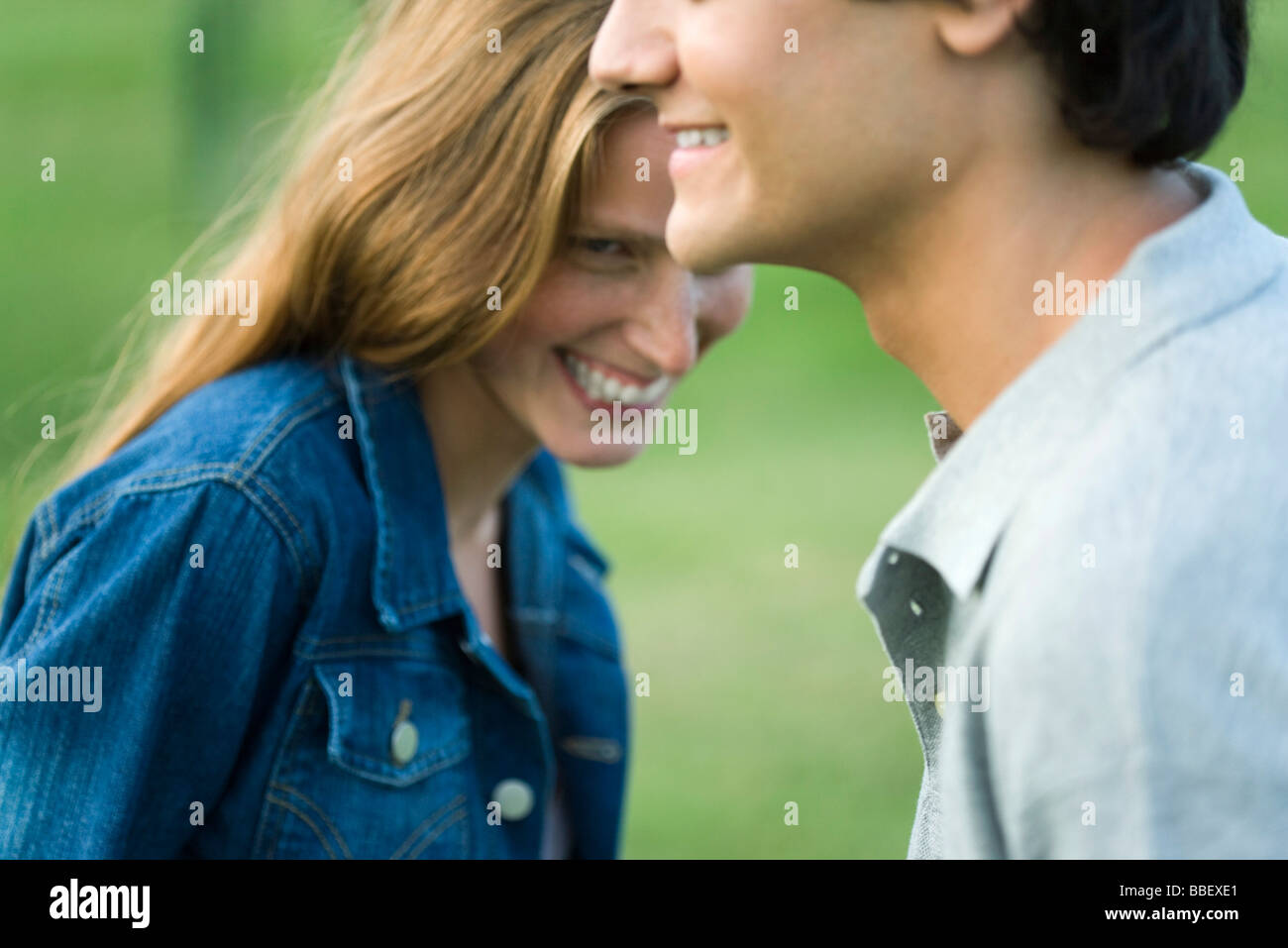 Young couple laughing, cropped Stock Photo - Alamy