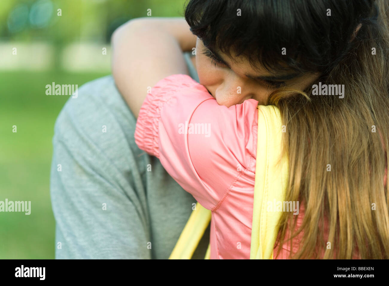 Young couple embracing, man's head on woman's shoulder, close-up Stock ...