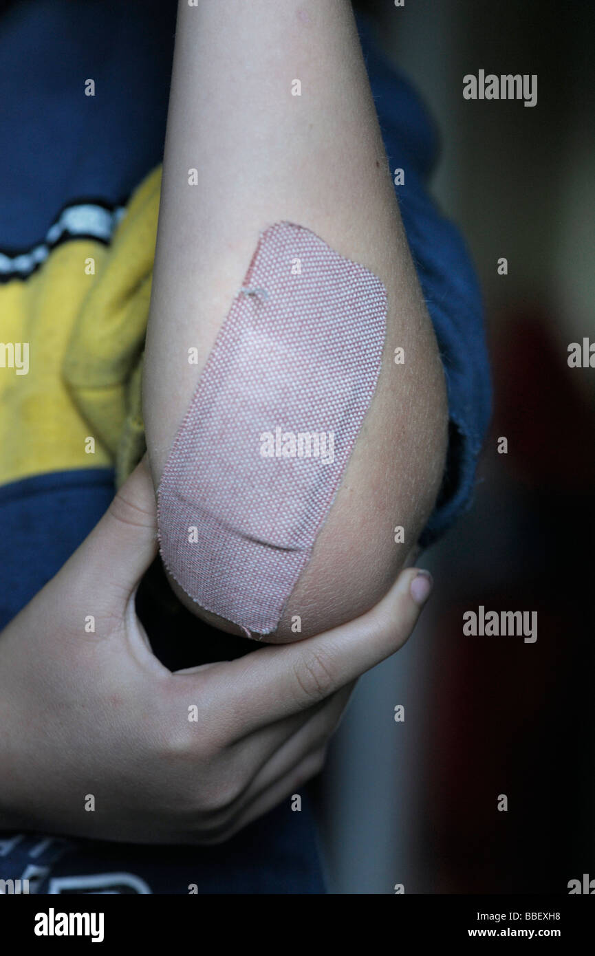Band aid on young arm hi-res stock photography and images - Alamy