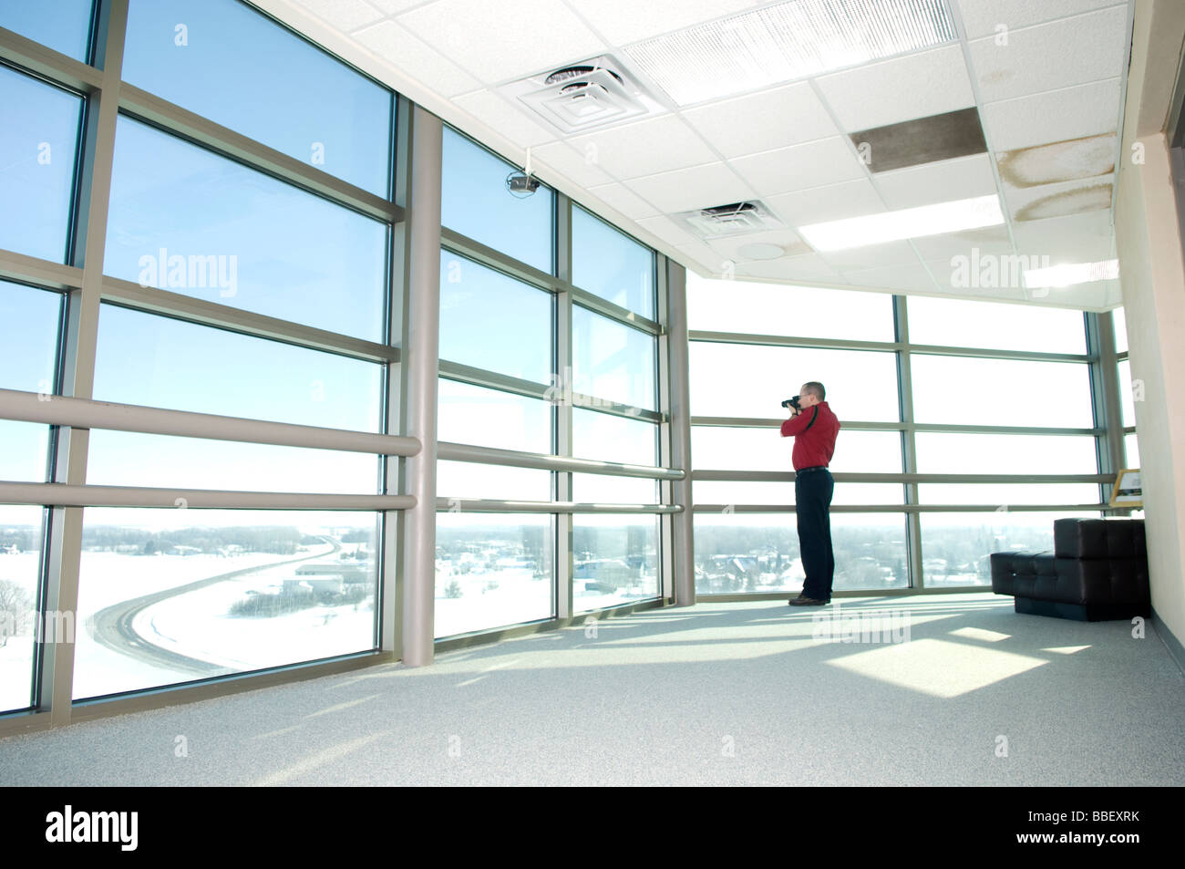 Man photographing in the observation tower of the Pembina State Museum ...