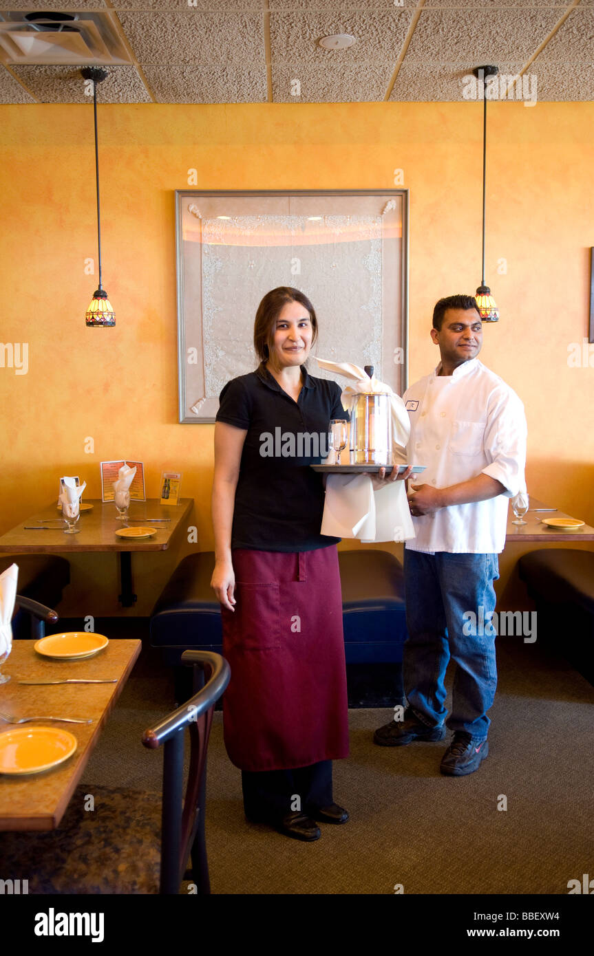 Waitress and chef in a restaurant Stock Photo - Alamy