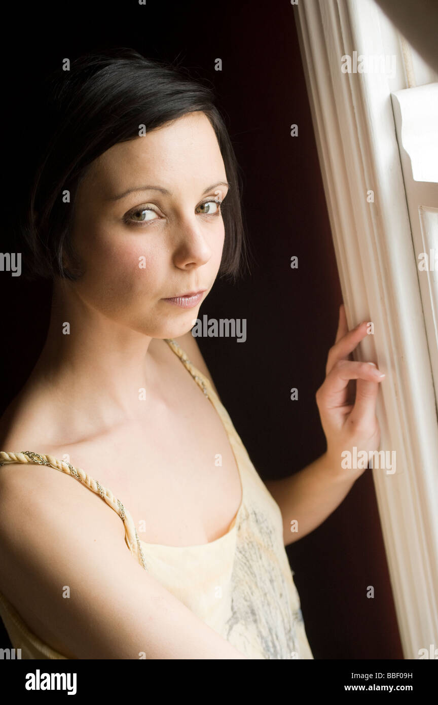 Portrait of a pretty young girl looking serious Stock Photo - Alamy