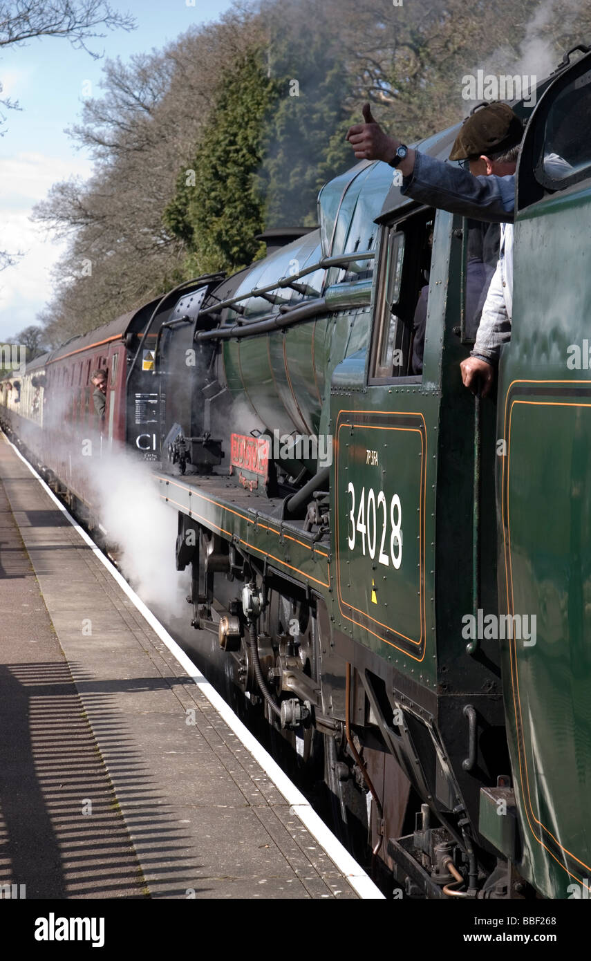 Steam train leaving a raiway station on the West Somerset Railway Stock ...