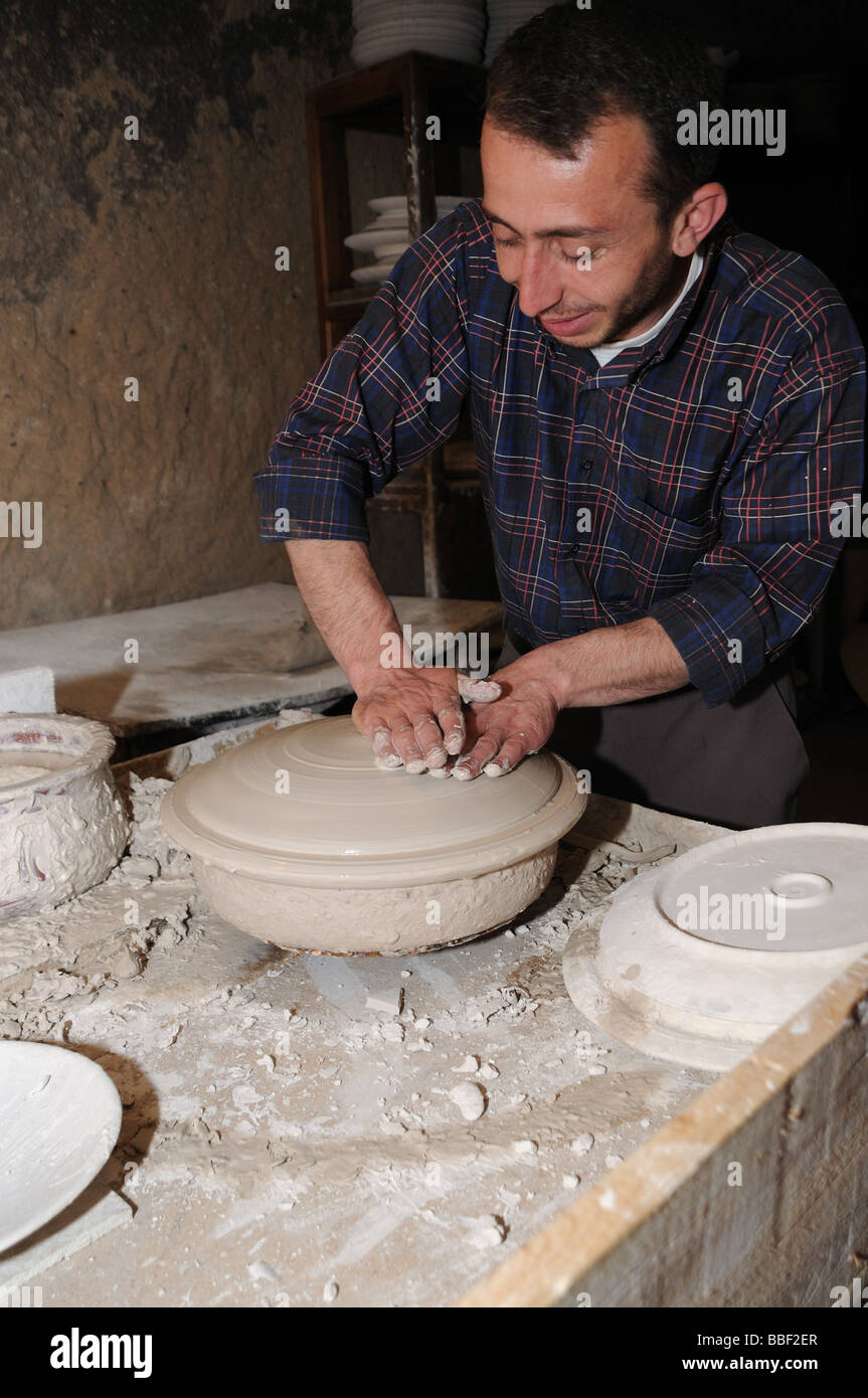 A potter at the Firca pottery in Avanos Cappadocia makes a plate with ...