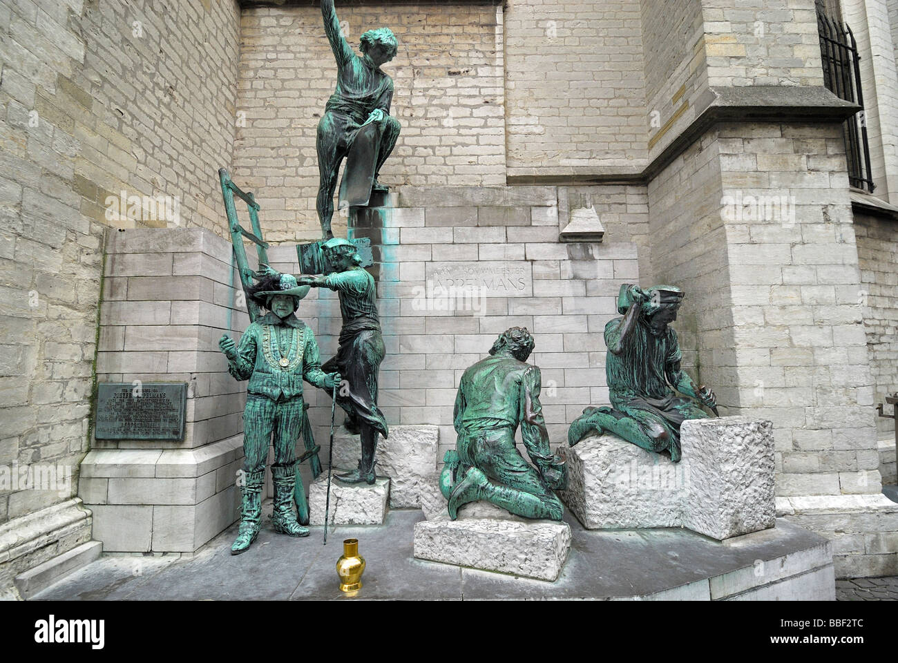 Street performer on left standing among statues outside Cathedral of ...