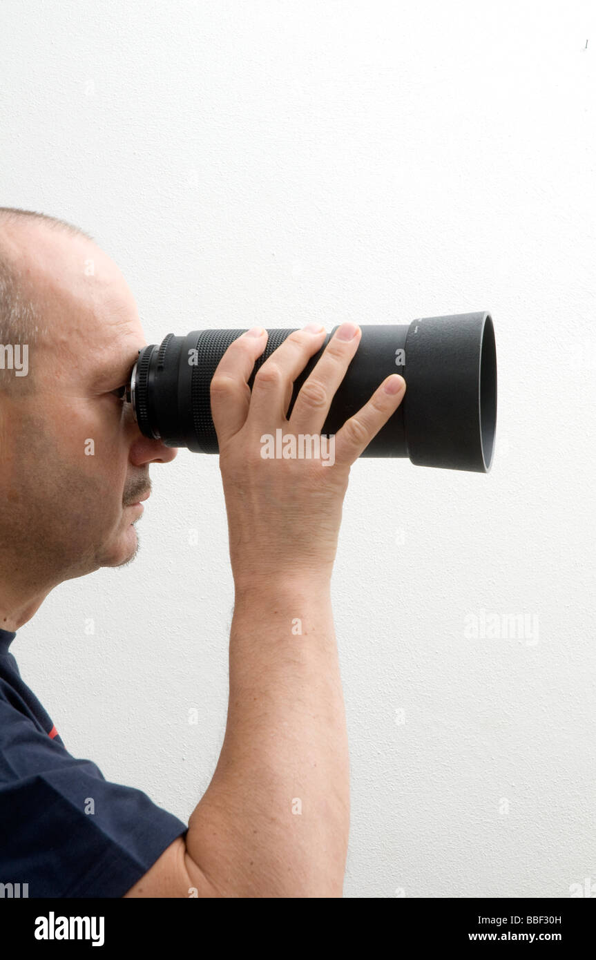 A photographer look throungh the lens Stock Photo - Alamy
