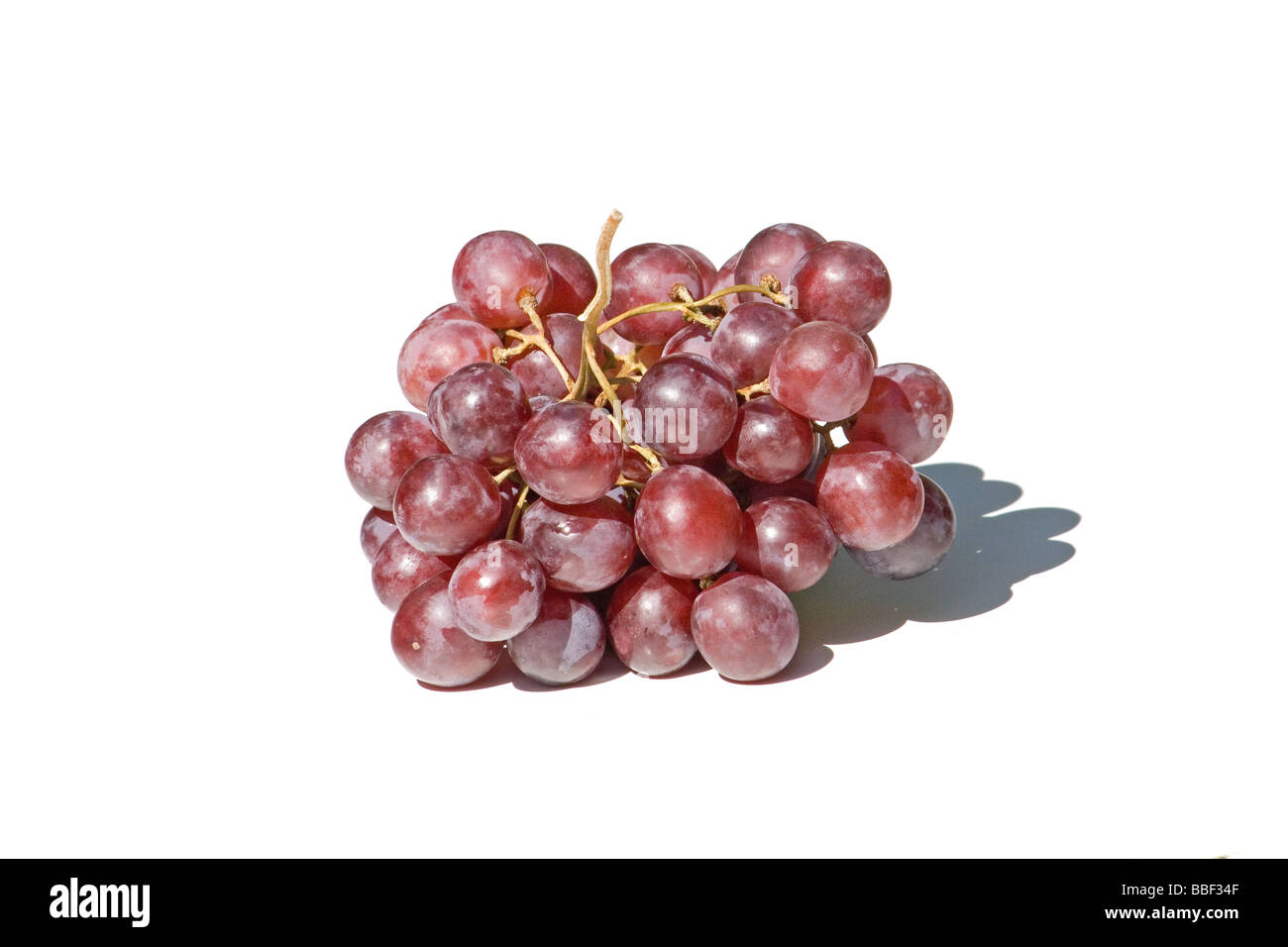 Cluster of red grapes on white background Stock Photo - Alamy
