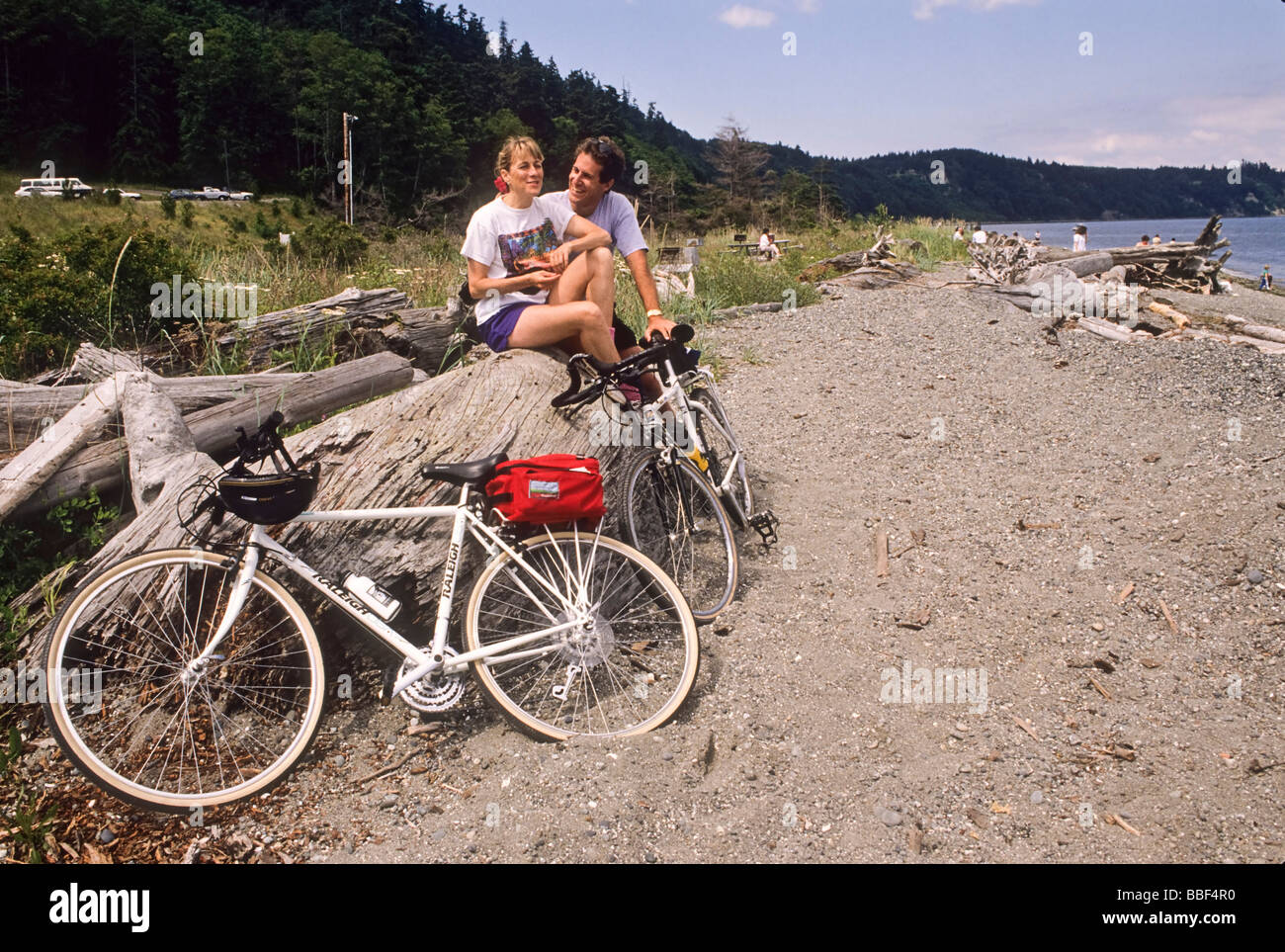Man and woman bicycle riders take a break at Possession Point Whidbey ...