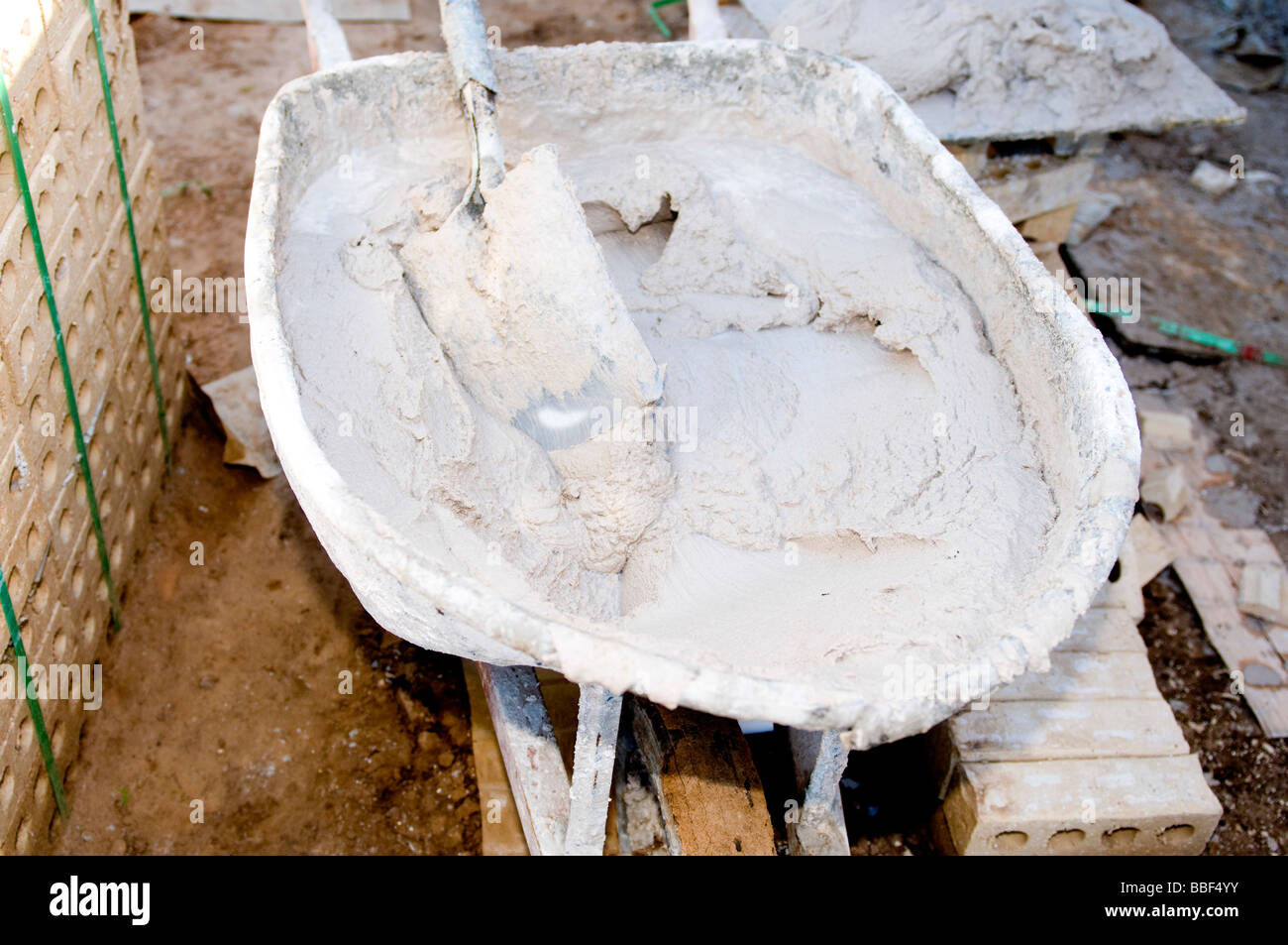 A wheelbarrow full of mortar for laying bricks, and a shovel. Oklahoma ...