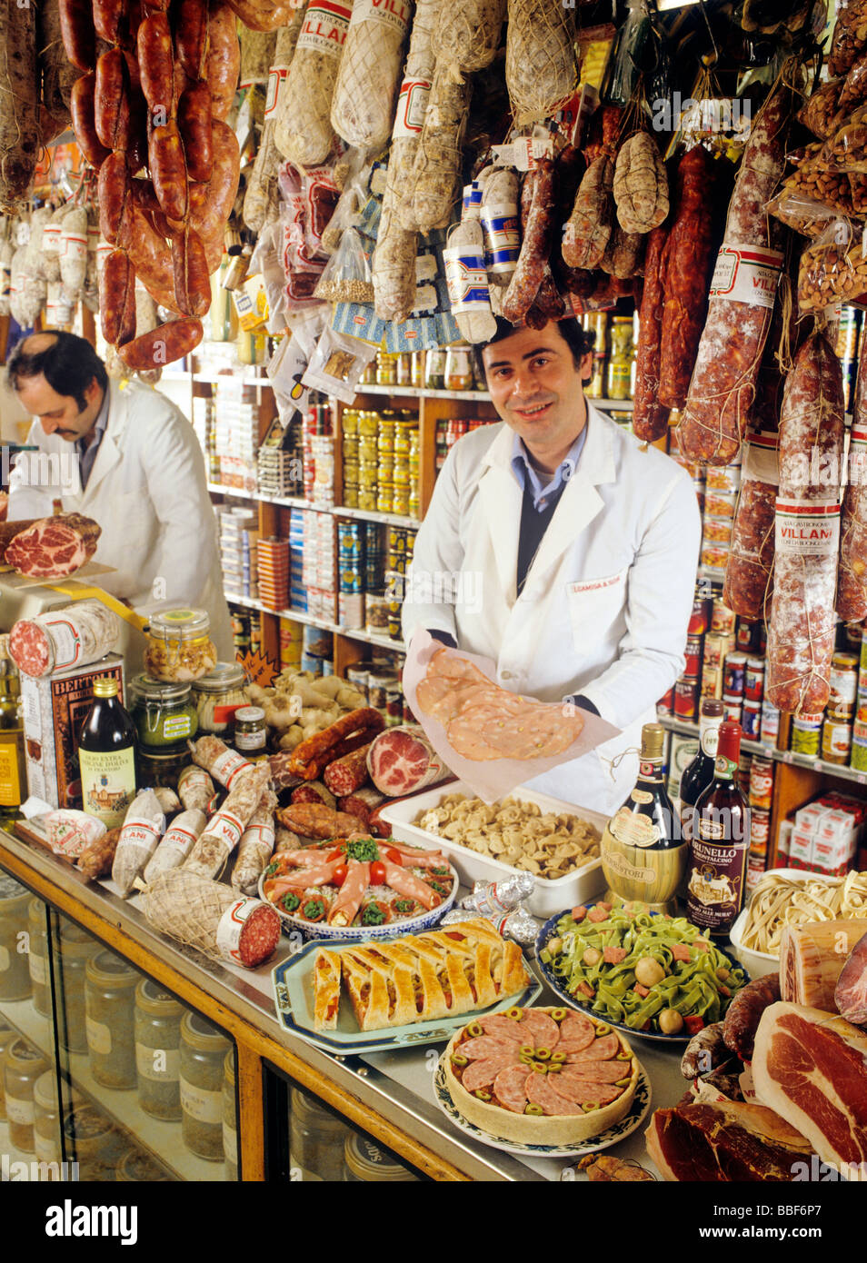 portrait of vendors in delicatessen shop italy Stock Photo - Alamy