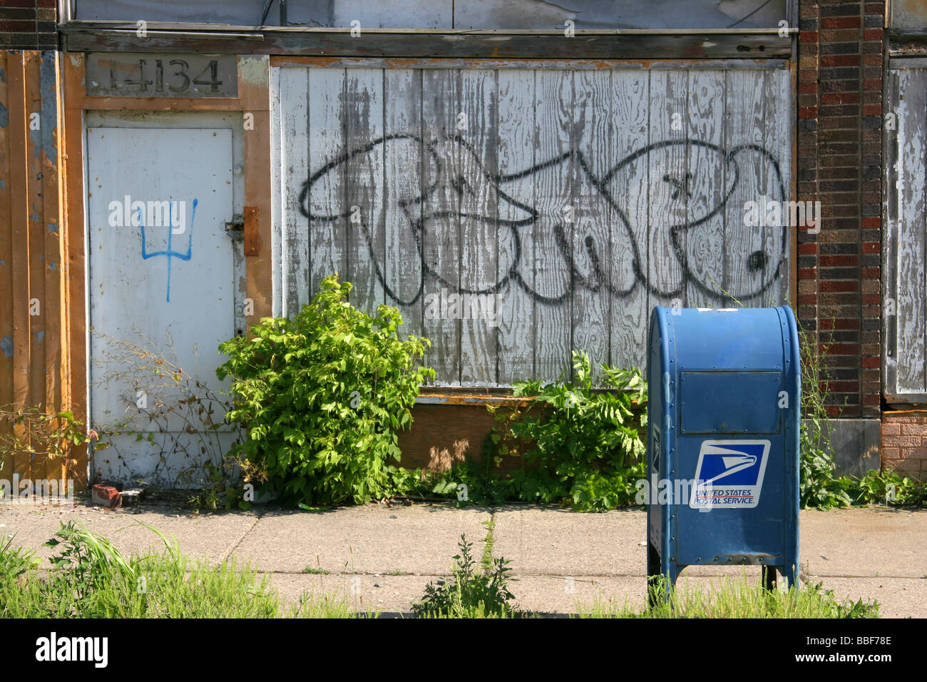 Boarded up building with gang markings Mack Avenue Detroit USA Stock ...