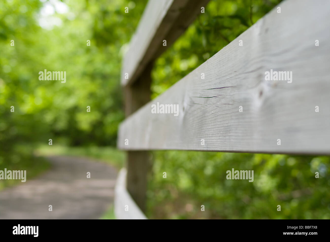 Wooden rail on trail Stock Photo - Alamy