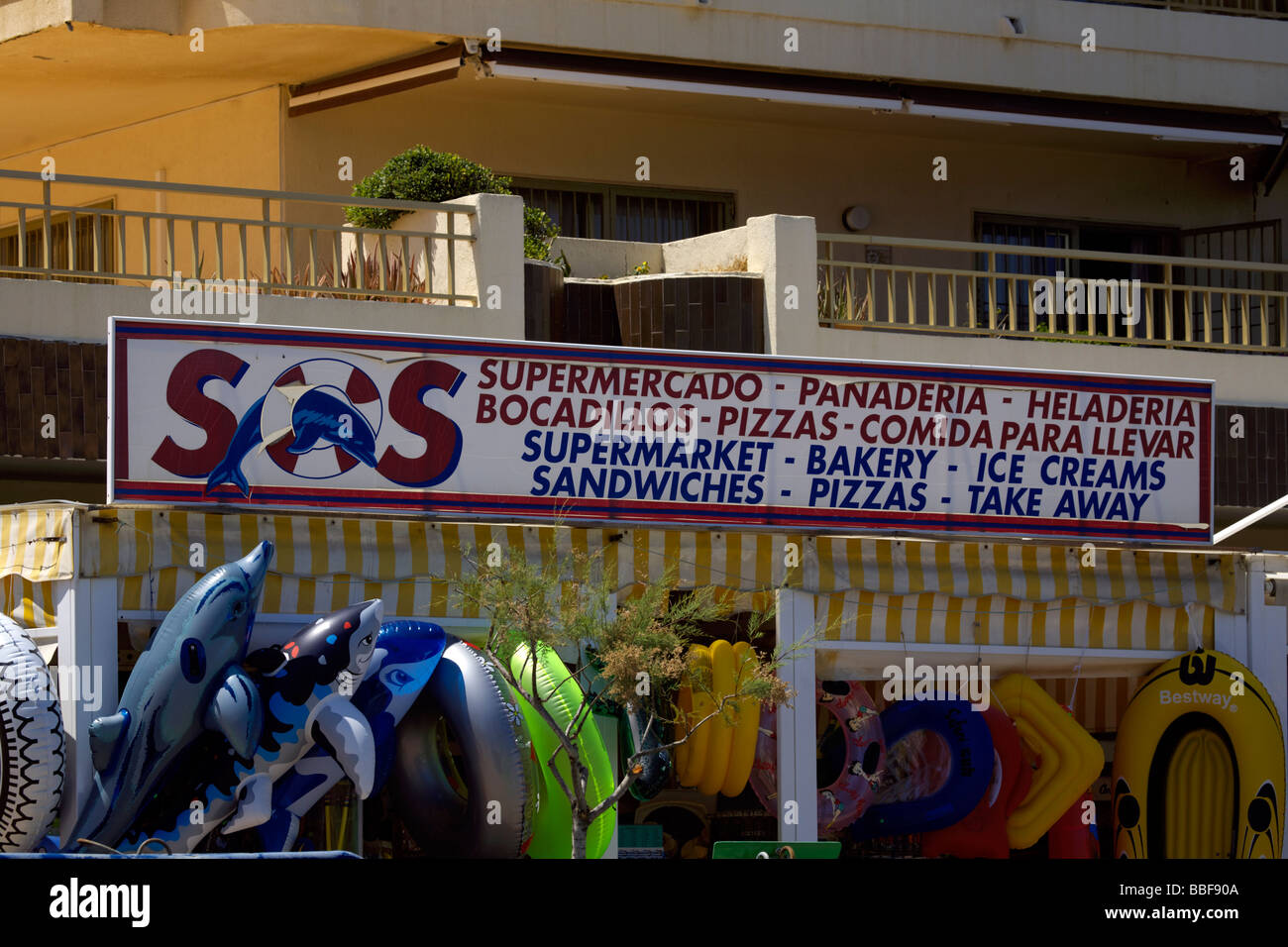 Bilingual shop sign, sign in two languages, English and Spanish ...