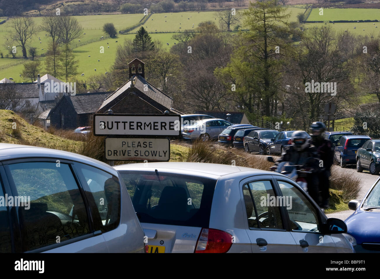 Buttermere sign. The Lake District in Cumbria becomes overcrowded with ...
