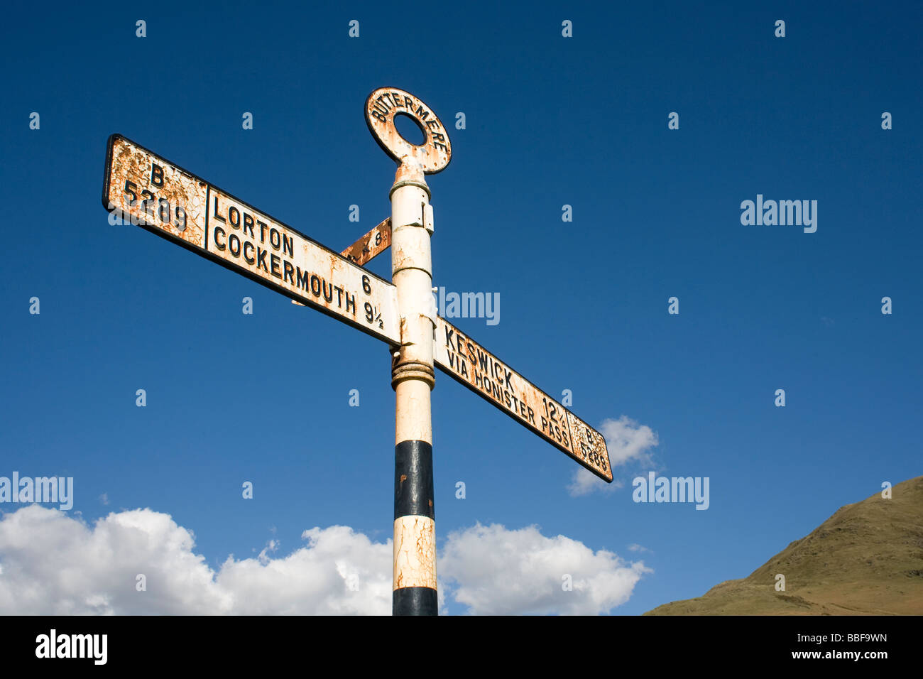 Traditional metal sign giving directions and distance to Lorton ...