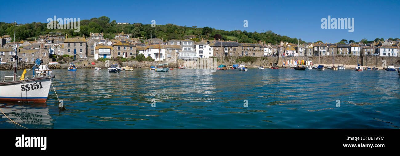 Panoramic view of Mousehole harbour as the tide comes in Stock Photo ...