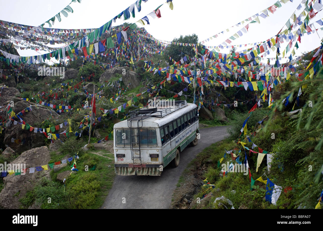 Bus and prayer flags. Rewalsar Lake. Kullu Valley. Himachal Pradesh ...