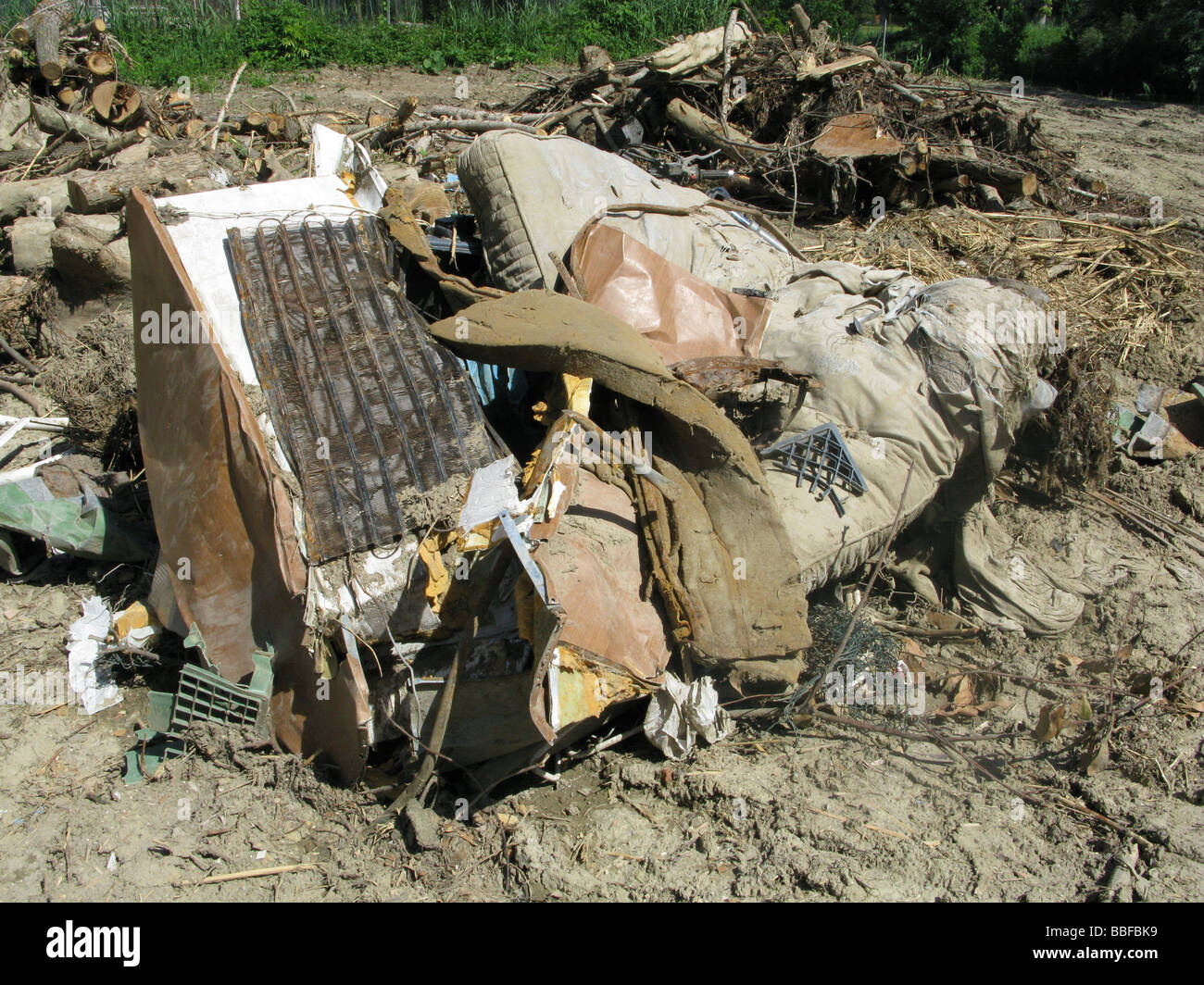 pile of rubbish waste in muddy field Stock Photo - Alamy