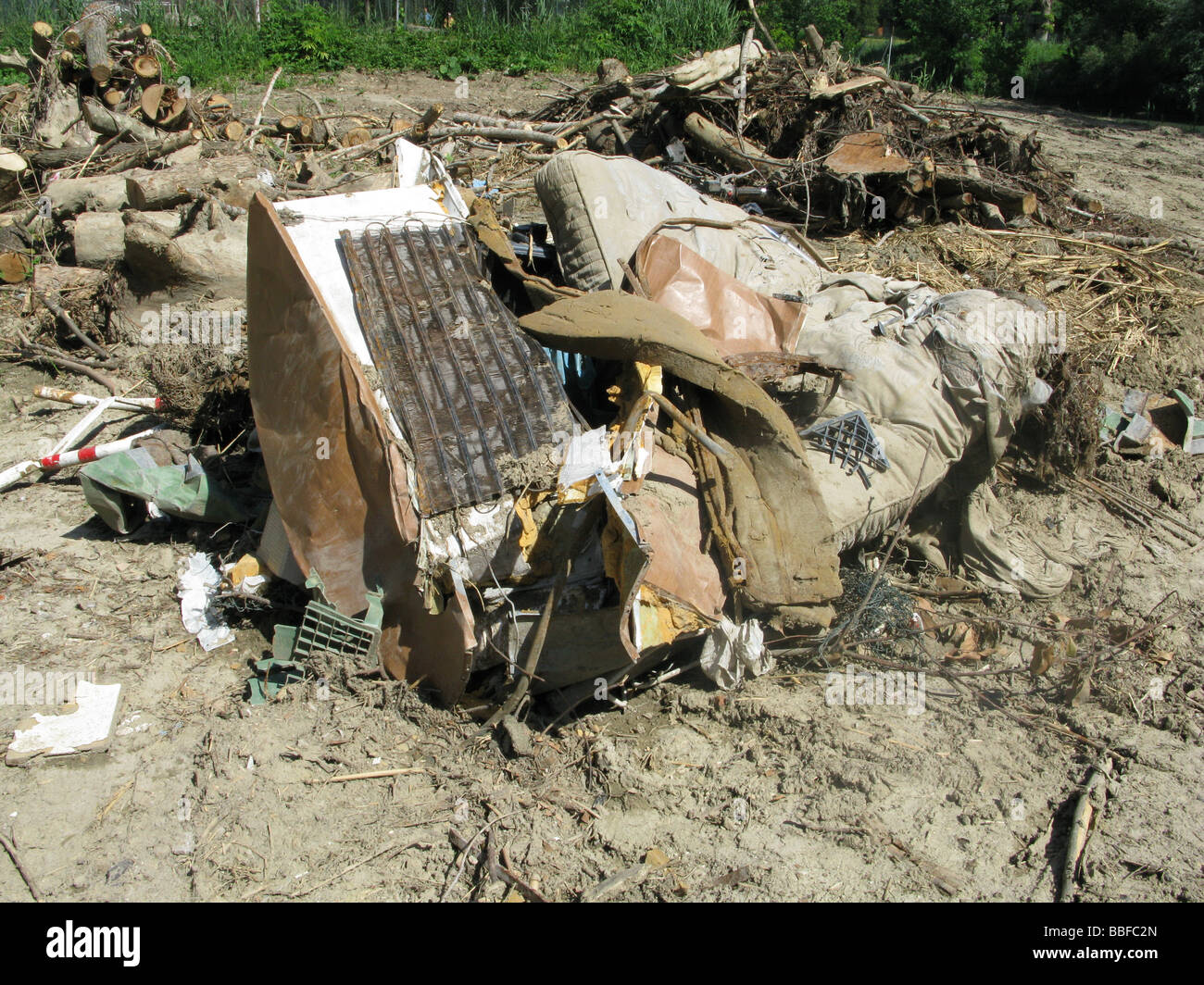 pile of rubbish waste in muddy field Stock Photo - Alamy