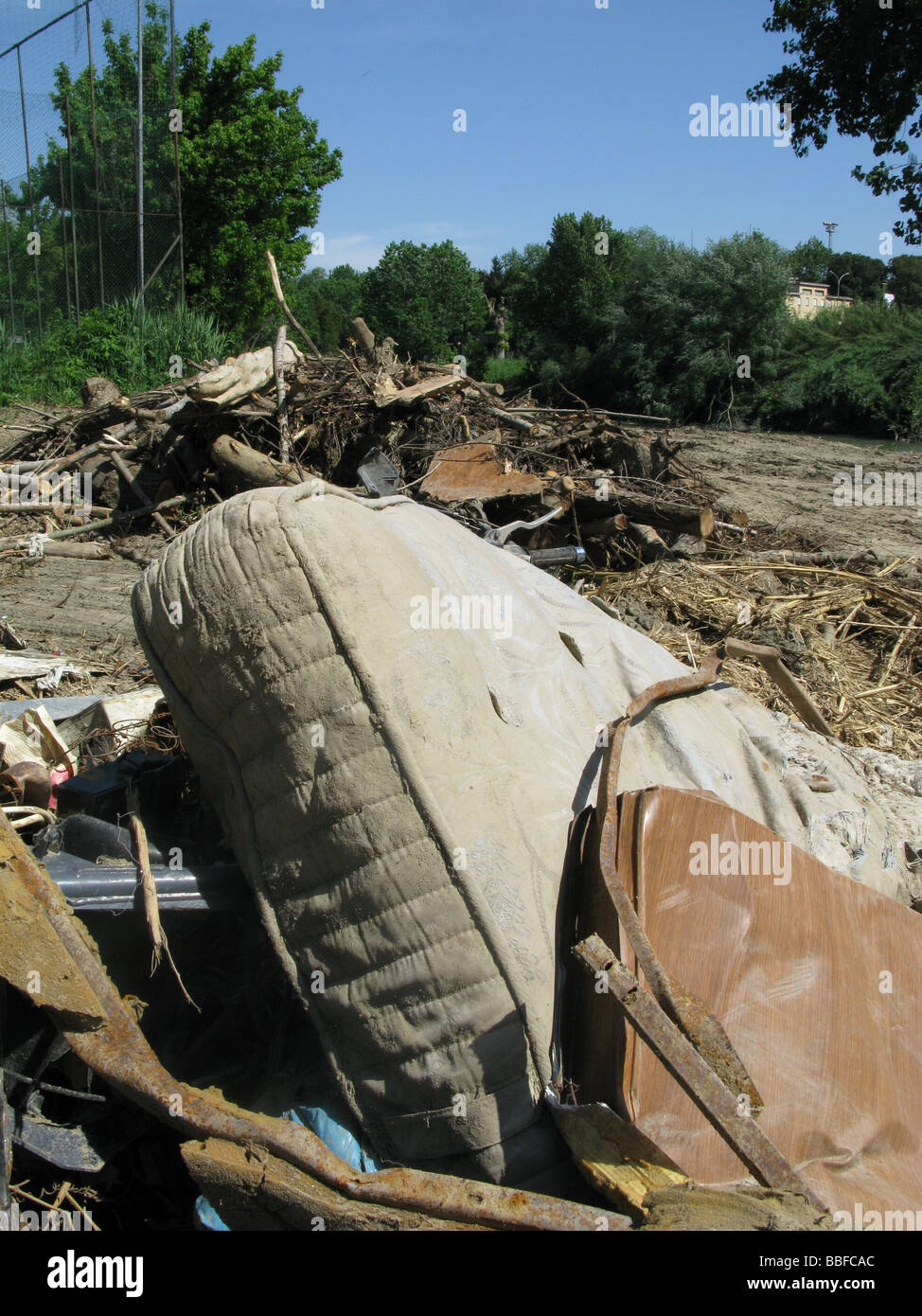 pile of rubbish waste in muddy field Stock Photo - Alamy