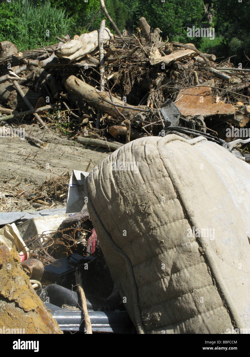 pile of rubbish waste in muddy field Stock Photo - Alamy