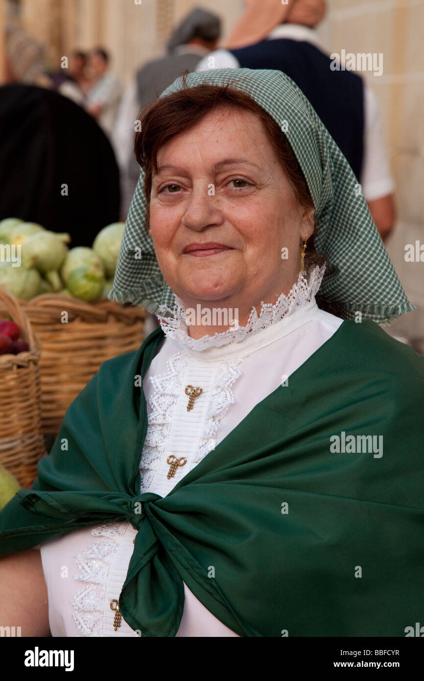 Maltese vegetable seller in traditional costume Stock Photo - Alamy