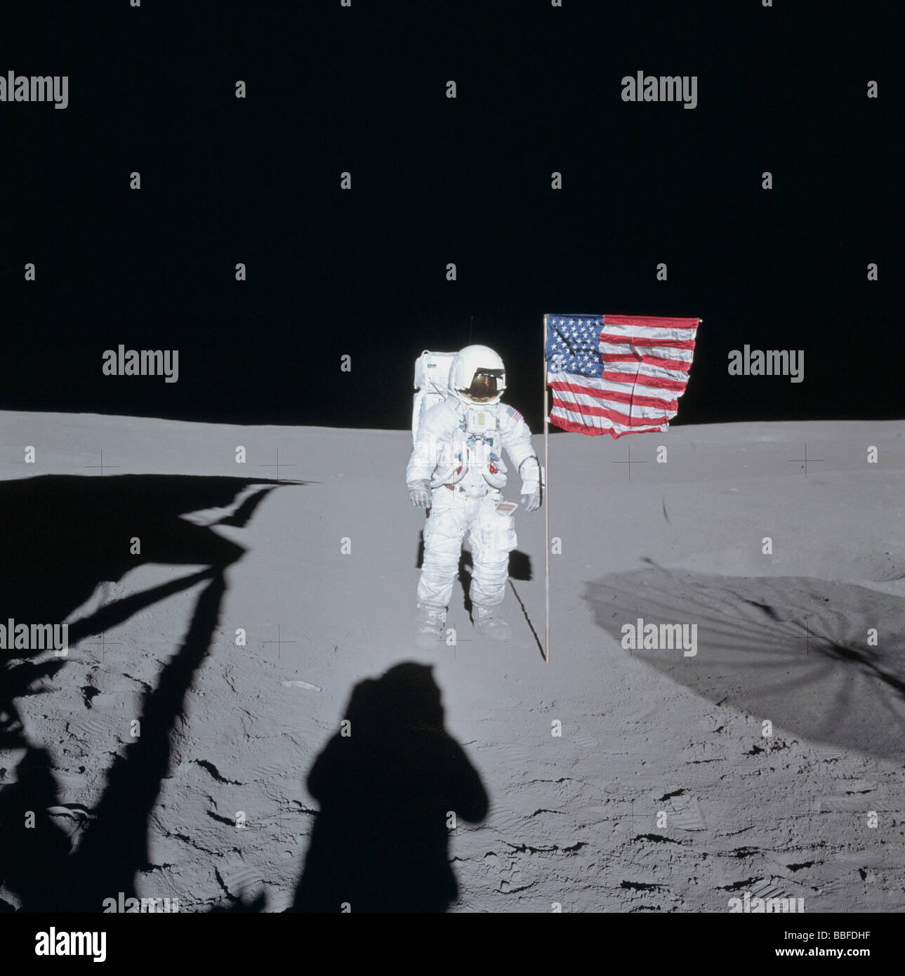 NASA astronaut holding flag on Moon photographed by Apollo crew Stock ...