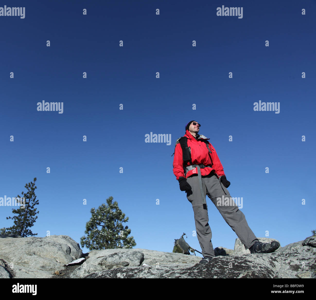 Male stand on the rock Stock Photo - Alamy
