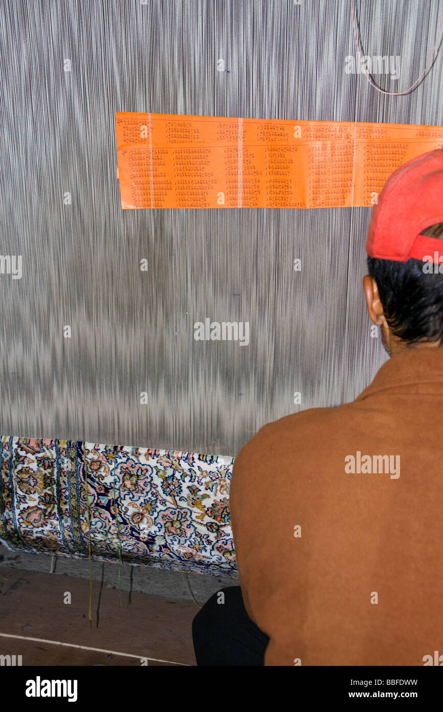 Demonstration of traditional hand weaving of silk carpet Stock Photo ...