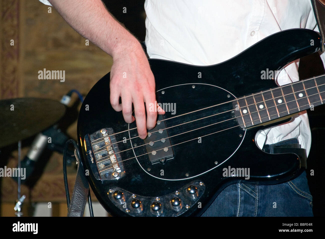 Closeup of base guitarist from the Sarah Coloso Band performing live ...