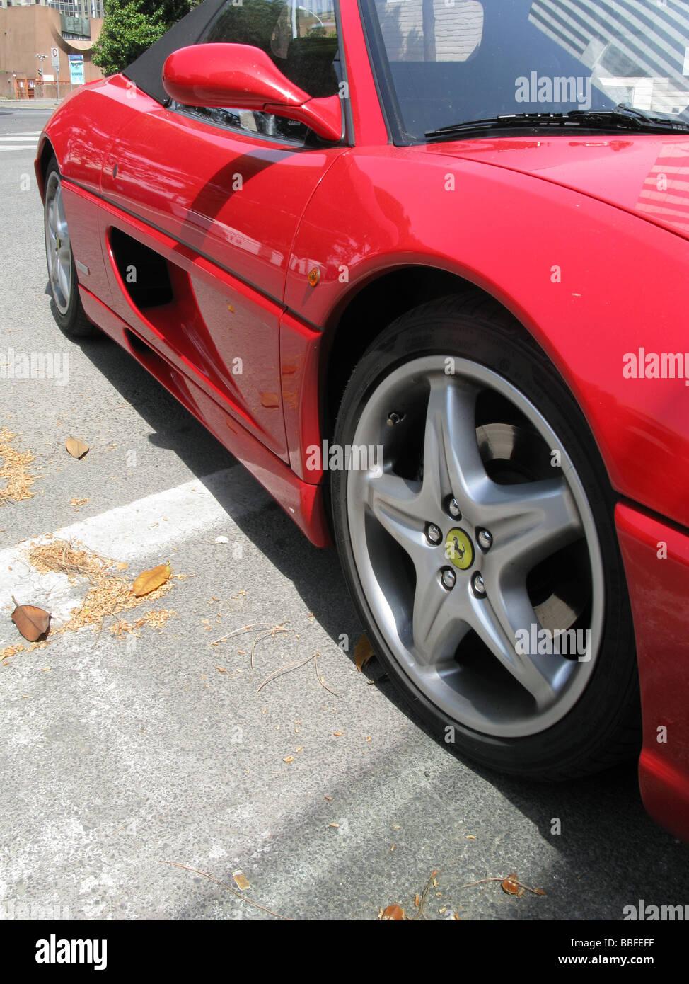 one red ferrari sports car in street in rome italy Stock Photo - Alamy