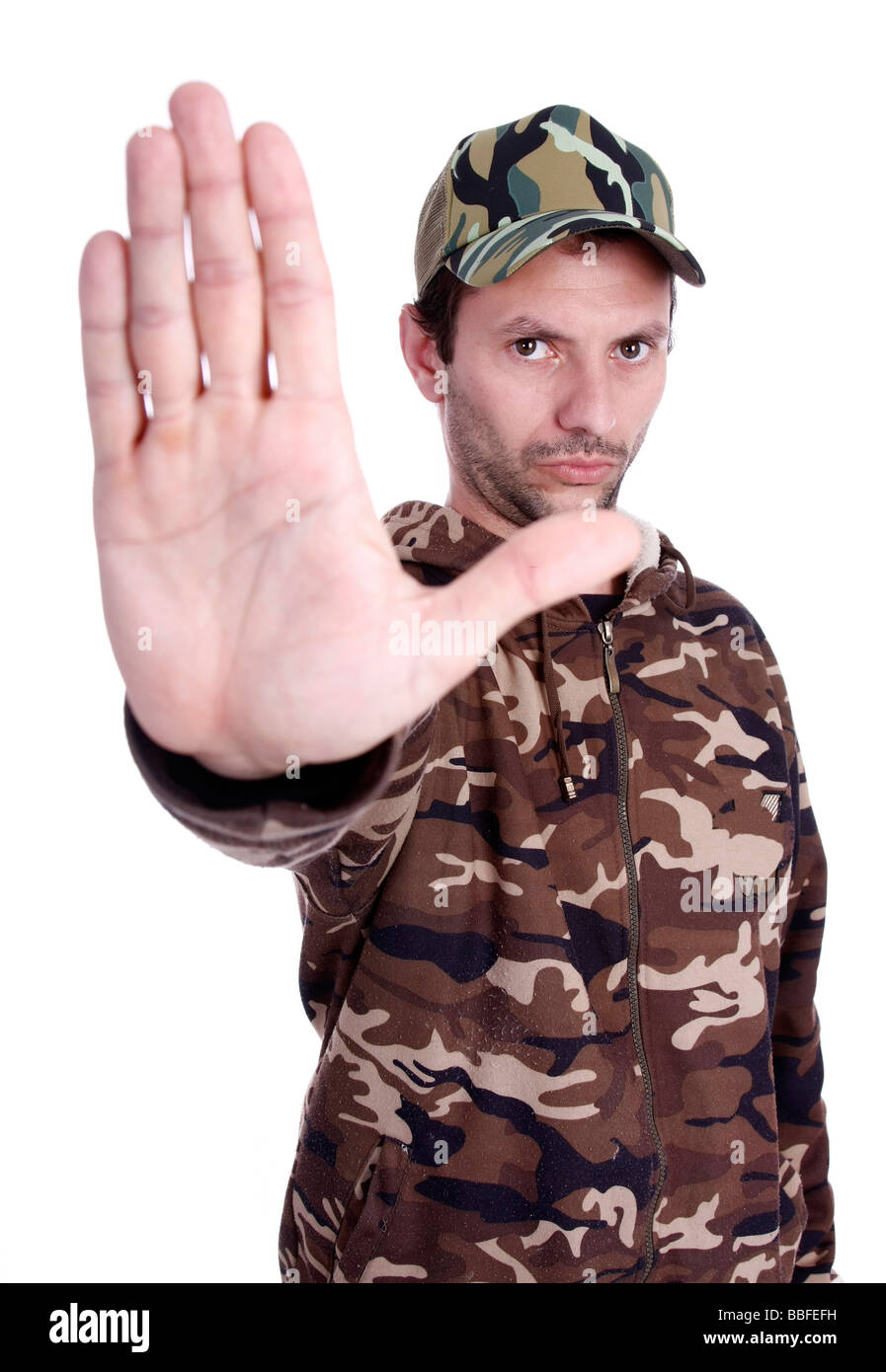 A man dressed with camouflaged uniform giving a command Stock Photo - Alamy